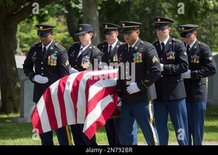 The casket of Lt. Col. Jaimie Leonard is carried by an honor guard as ...