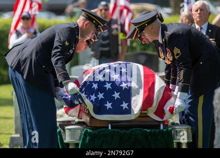 The casket of Lt. Col. Jaimie Leonard is carried by an honor guard as ...