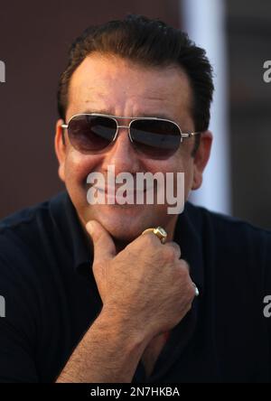 Bollywood actor Sanjay Dutt smiles as he arrives at a special court ...