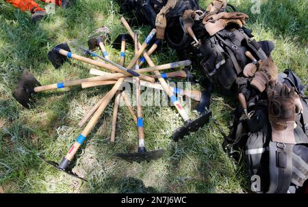 Inmates from the Washington Ridge Conservation Camp practice creating a ...