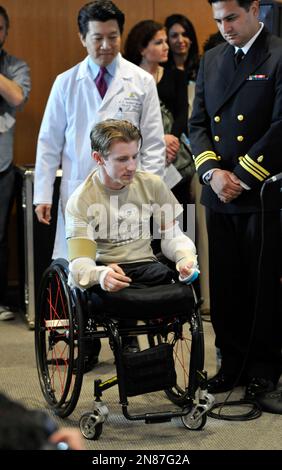 Retired Infantryman Brendan M. Marrocco listens during a news ...