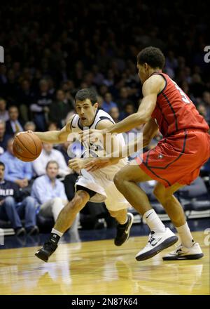 Butler guard Alex Barlow, left, heads up court after stealing the ball ...