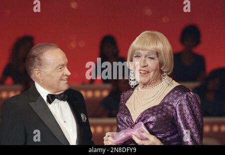 Milton Berle, in drag, performs a skit with Bob Hope during taping of ...