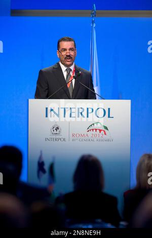 Interpol Secretary General Ronald K. Noble, left, talks with Interpol ...