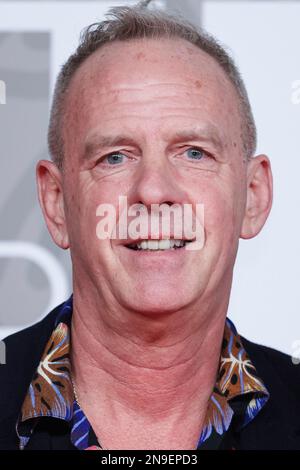 Norman Cook poses for photographers upon arrival at the Olivier Awards ...