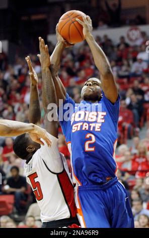Boise State's Derrick Marks shoots over Wyoming's Charles Hankerson Jr ...