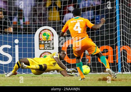 Zambia's goalkeeper Kennedy Mweene, left, dives to save a penalty kick ...