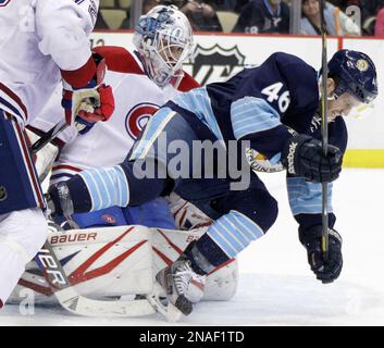 Pittsburgh Penguins' Joe Vitale (46) is checked by Columbus Blue ...