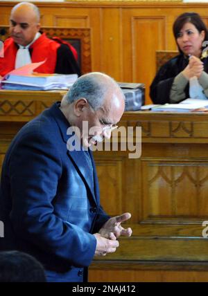 Tunisian Interior Minister Rafik Haj Kacem speaks during a press ...
