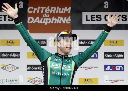 Christophe Kern, of France, celebrates on the podium after winning the ...