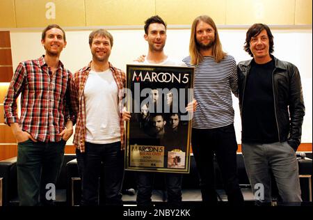 Members of American rock band Maroon 5, lead singer Adam Levine, right ...