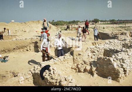 French archaeologist Pierre Lombard, right, looks over the excavation ...