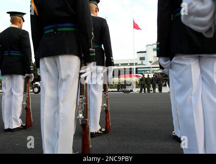 Philippine military pallbearers prepare to transfer the flag-draped ...