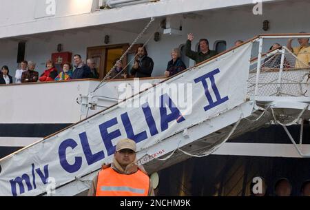 Greek-owned cruise ship 'Clelia II' is towed to the port of the town of ...