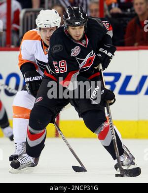 Carolina Hurricanes' Chad LaRose (59), Ryan Carter (29), and Joni ...