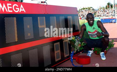 Kenya's David Rudisha poses behind the scoreboard after setting a world ...