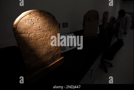 An Egyptian archeological technician works at a pharonic falcon mummy ...