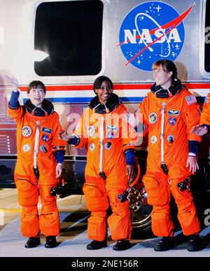 Three female astronauts of the space shuttle Discovery crew, from left ...