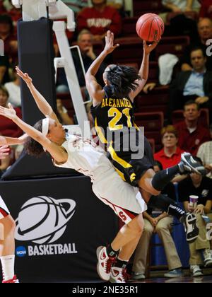 Iowa guard Kachine Alexander, left, drives to the basket past Drake ...