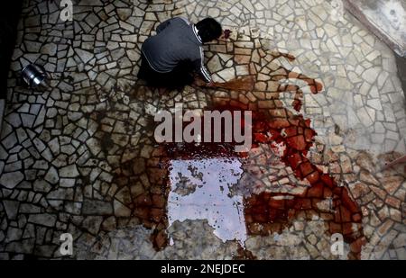 An Indian Shiite Muslim cleans blood from his face after flagellating ...