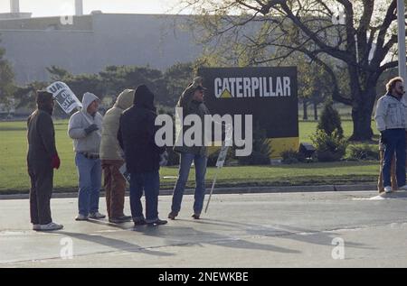 UAW members walk out on strike and work the picket line at the ...