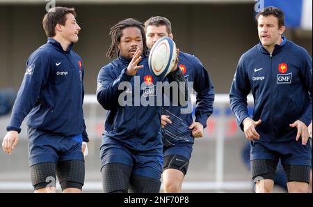 French rugby players, from left, Alexis Palisson, Jean Marc Doussain ...