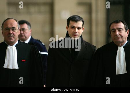 French judge Fabrice Burgaud, center, flanked by his lawyers Patrick ...