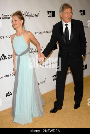 Calista Flockhart, left, and Harrison pose for photographers upon ...