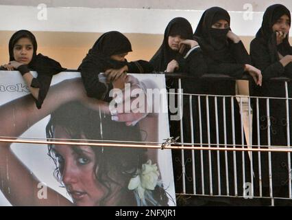 Shiite Muslim women watch Shiite men beat their chests after beating ...