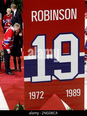 Former Montreal Canadiens defenseman Larry Robinson, left center, wipes ...