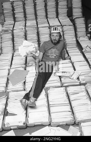 Fred Lebow, president of the New York Roadrunners Club, gazes at a TV ...