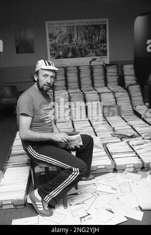 Fred Lebow, president of the New York Roadrunners Club, gazes at a TV ...