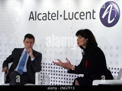 Alcatel-Lucent Chairman of the Board Serge Tchuruk, left, gestures as ...