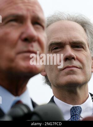 Massachusetts Attorney General Thomas Reilly, left, accompanied by ...