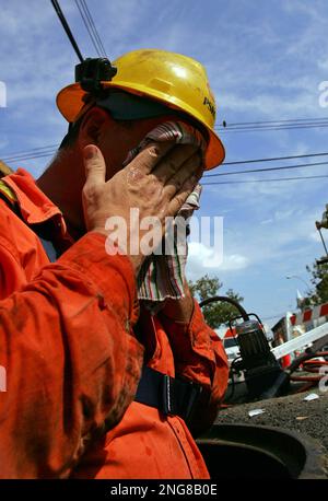 Ron Stankus, an underground technician from PSE&G, takes a break as he ...