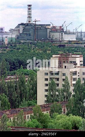 A chimney over the destroyed reactor at the Chernobyl nuclear power ...