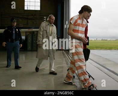 David Ludwig is escorted to an Indiana State Police plane after waiving ...