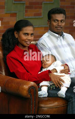 Abilass Jeyarajah, popularly known as 'Baby 81", is held by his mother ...