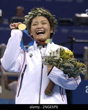 Kaori Icho of Japan shows her gold medal during the award ceremony of ...