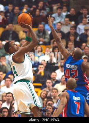 Detroit Pistons guard Jerry Stackhouse, left, in streetclothes, listens ...