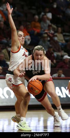 Virginia Tech's Georgia Amoore (5) drives past Nebraska's Callin Hake ...