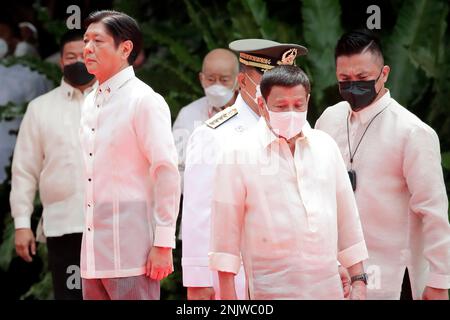 Incoming Philippine president Ferdinand Marcos Jr., left, and outgoing ...