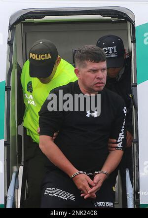 In this handout photo released by Colombia's Attorney General Press Office, police interview ...