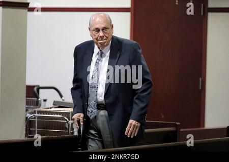 Former Tampa police captain Curtis Reeves points to his left eye while ...