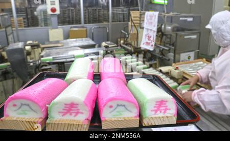 Workers make Kamaboko precessed fish paste for Osechi, Japanese ...