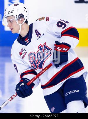 Regina Pats player Connor Bedard, lt, plays against Calgary Hitmen ...