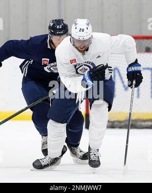 Winnipeg Jets' Blake Wheeler (26) knocks the puck away from Boston ...