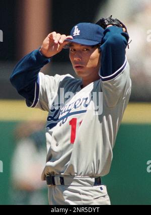Dodgers Pitcher Hideo Nomo adjusts his cap in his MLB debut in San ...