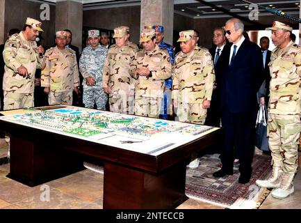 In this photo provided by Egypt's Suez Canal Authority, a tugboat ...