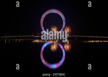 A Ferris wheel called Eye of Bohai changes color in the night of ...